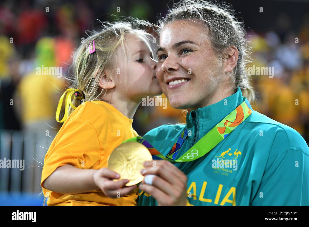Australia's Nicole Beck gets a kiss from her daughter Sophie after ...