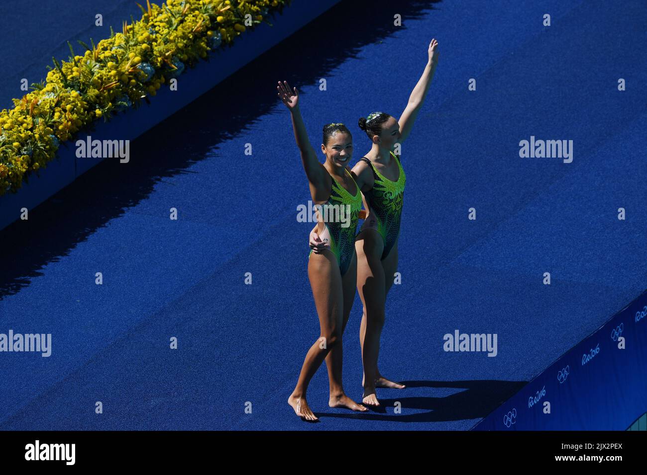 Australia's Nikita Pablo (left) and Rose Stackpole (right) wave to the crowds after competing ...