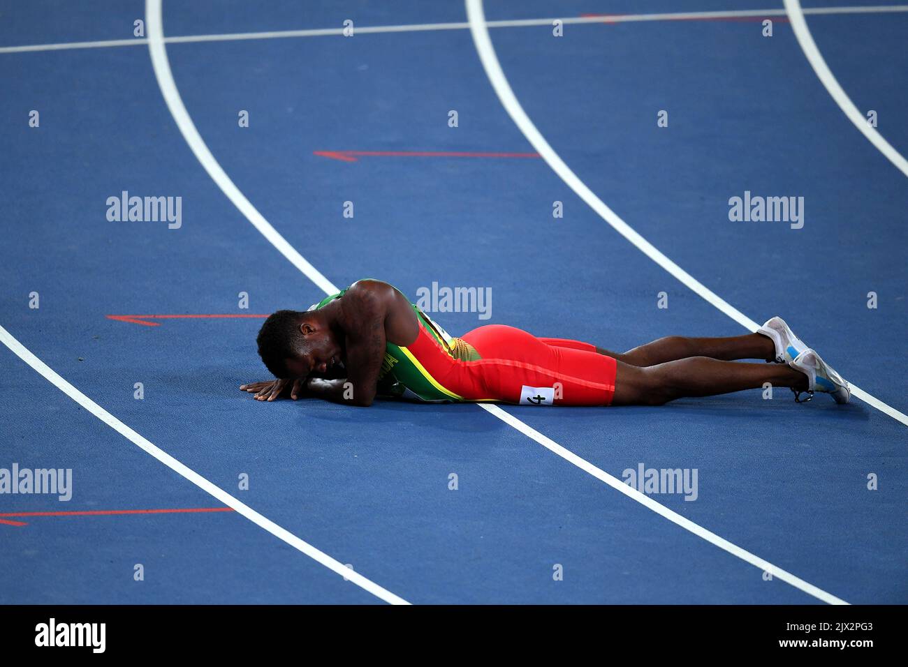 Bralon Taplin of Bahrain lies on the track after the Men's 400m final ...