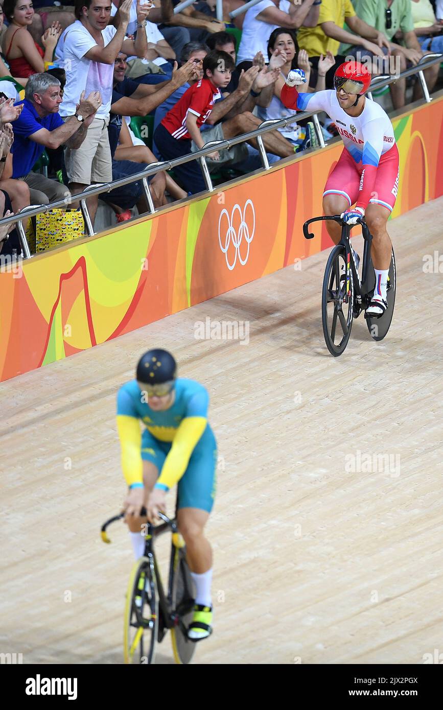Cyclist Denis Dmitriev of Russia celebrates winning the Bronze Medal ...