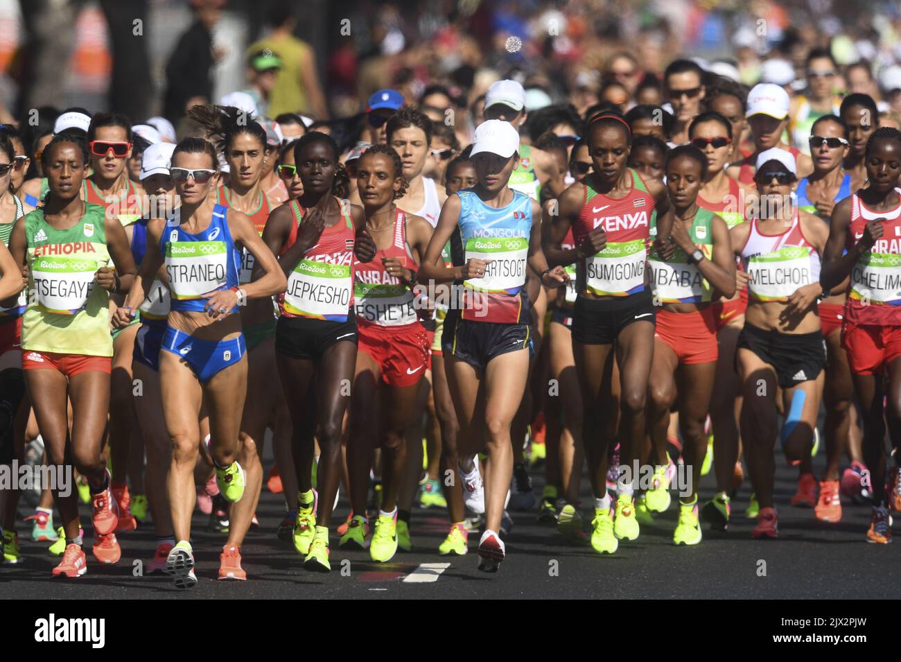 Runners are seen competing during the Women's Marathon on day nine of ...