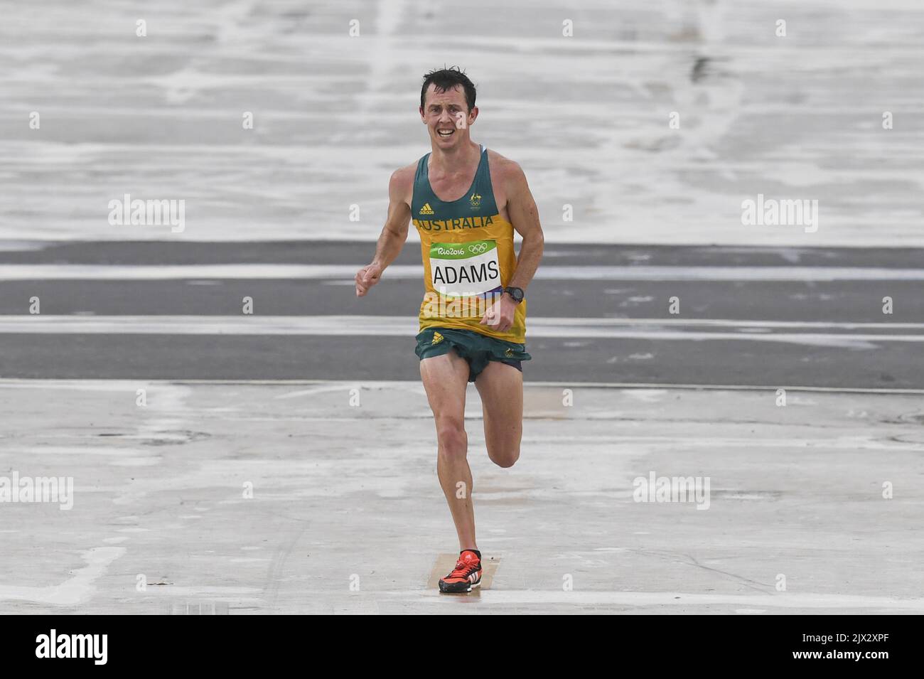 Liam Adams of Australia finishes the Men's Marathon on day sixteen of ...
