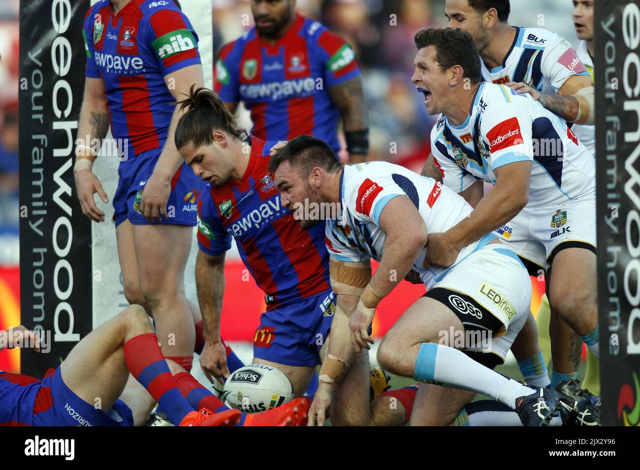 Luke Douglas of the Titans enjoys scoring a try with Greg Bird during ...