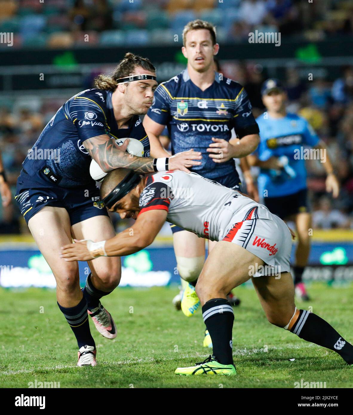 Cowboys Ethan Lowe tackled by Warriors Thomas Leuluai during the Round ...