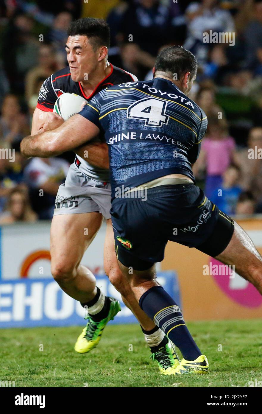 Nathaniel Roache of the Warriors tackled by Kane Linnett of the cowboys ...