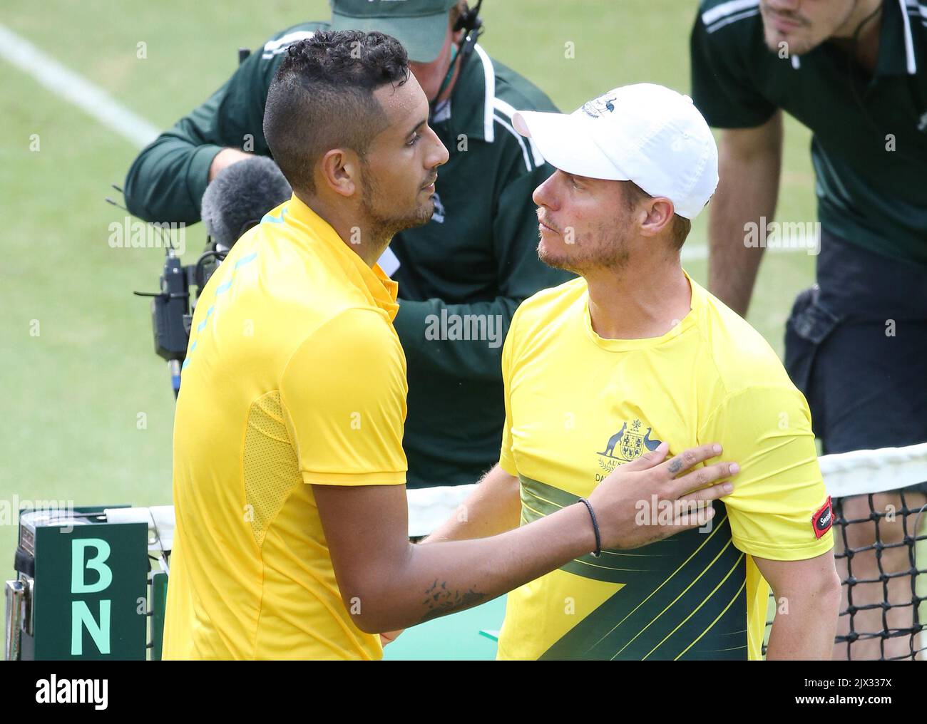 Australia's Nick Kyrgios(left) speaks with team captain Lleyton Hewitt ...