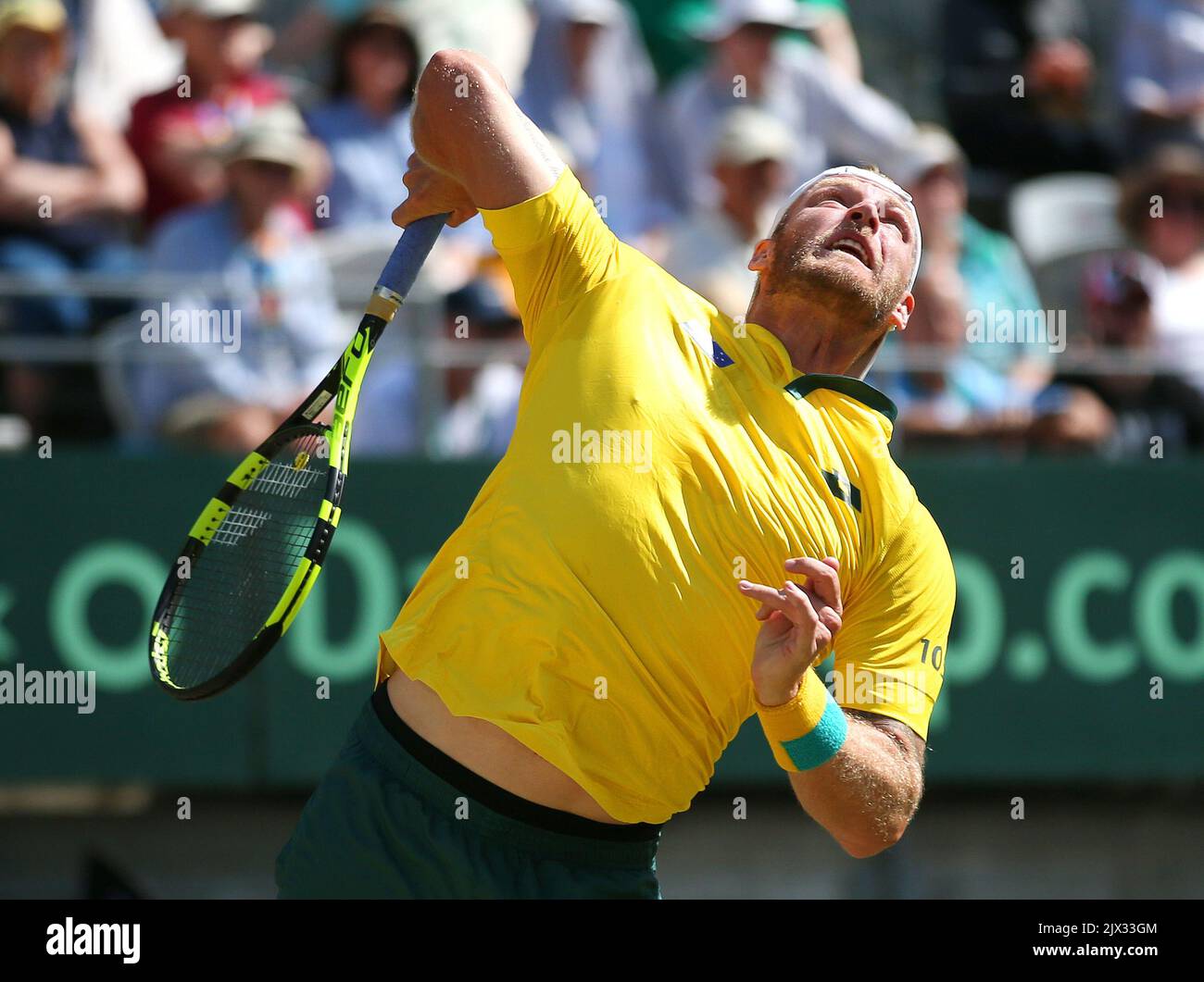 Australia's Sam Groth serves during the Davis Cup doubles match against ...