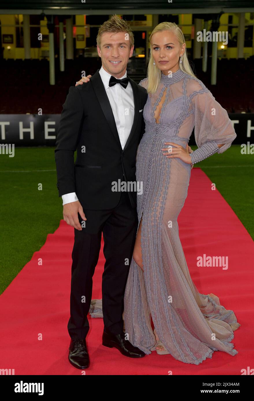 Kieren Jack of the Swans with his partner Charlotte Goodlet (dressed by ...