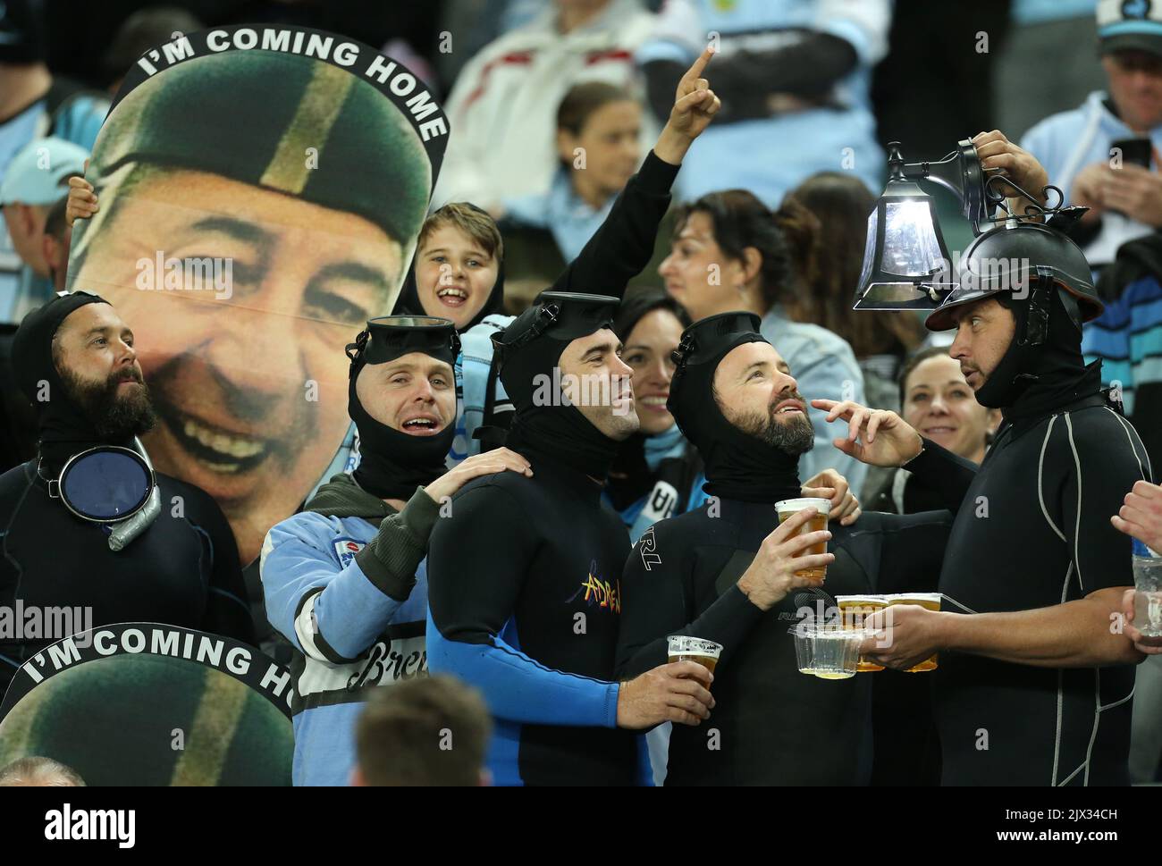 Cronulla fans in dressed as Harold Holt in wetsuits with Harold Holt ...