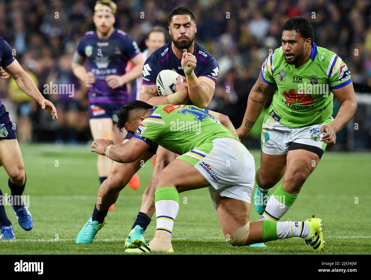 Storm prop Jesse Bromwich is tackled by Josh Papalii of the Raiders ...