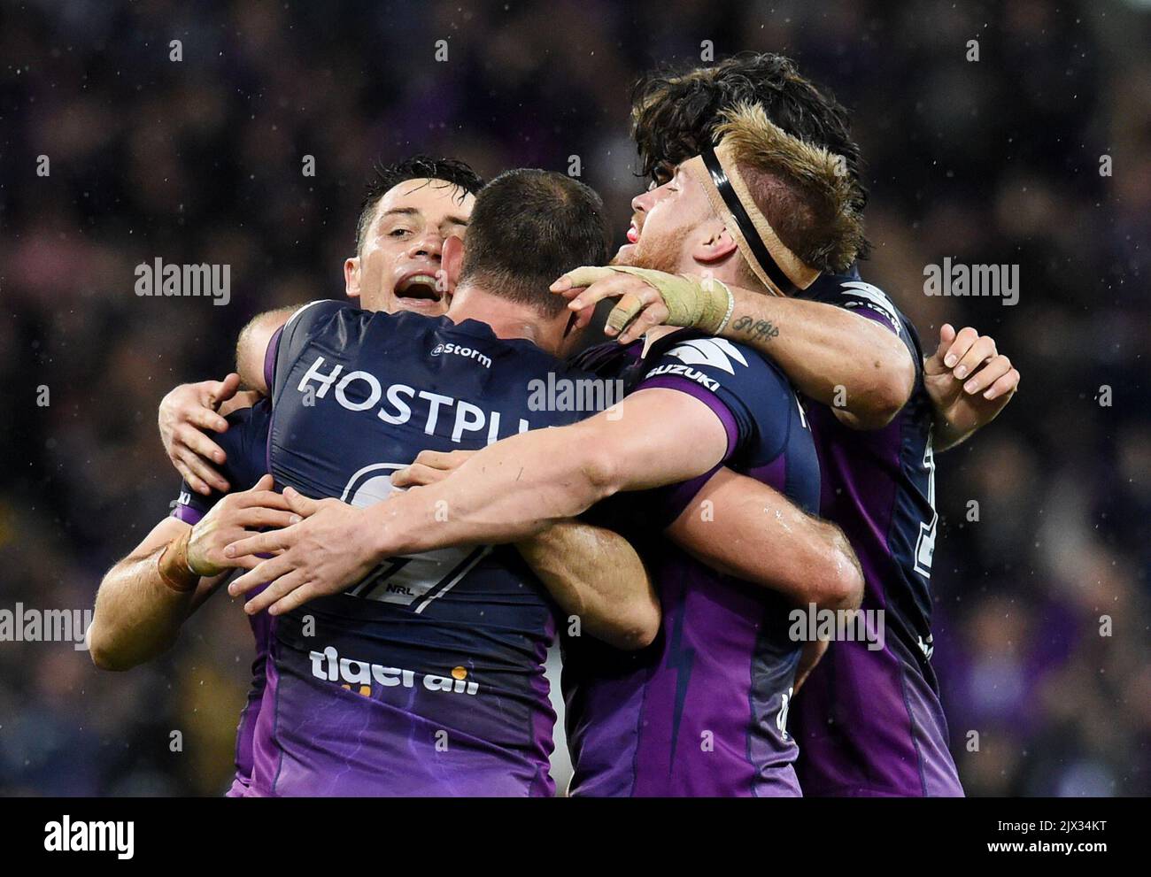 Storm halfback Cooper Cronk and the team congratulate Storm halfback ...