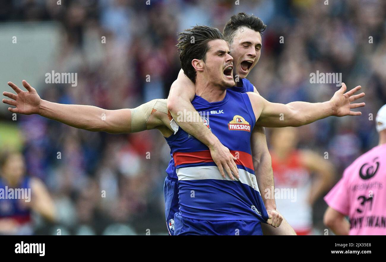 Tom Boyd (left) and Toby McLean of the Western Bulldogs (left) react ...