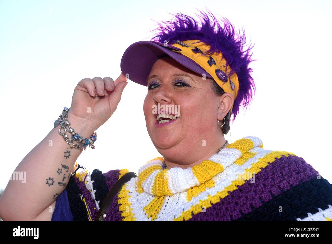 A Melbourne Storm fan poses for a photograph arrives for the NRL Grand ...