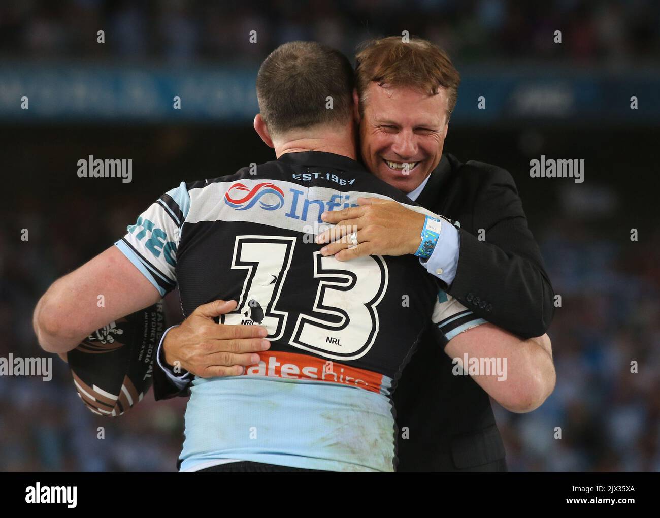 Paul Gallen of the Sharks is greeted on stage by former Sharks great ...