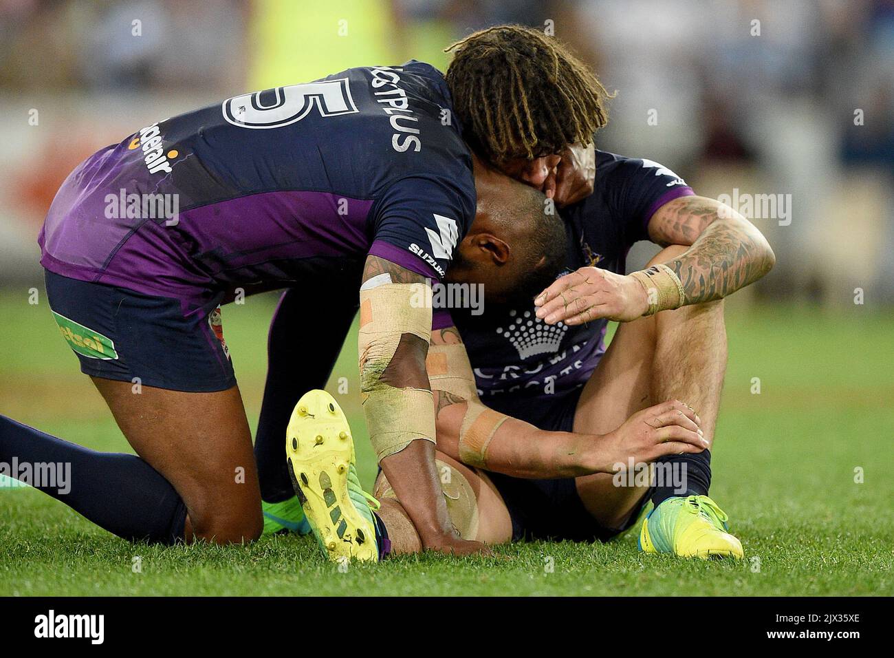 Kevin Proctor of the Storm, (right) is consoled by Marika Koroibete ...