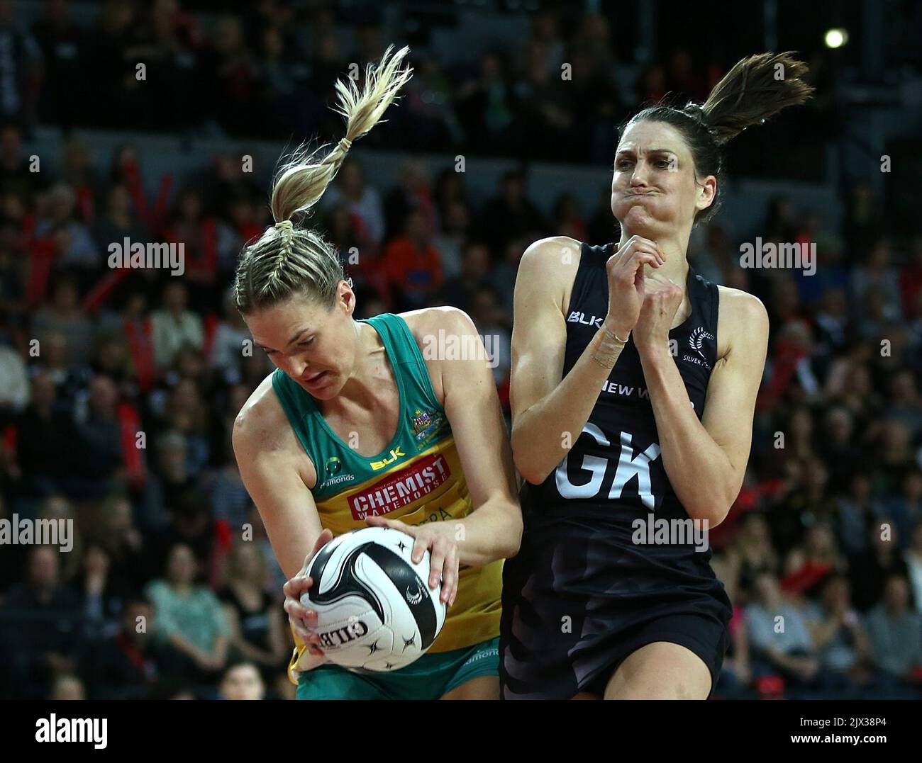 Caitlin Bassett of Australia and Anna Harrison of New Zealand during ...