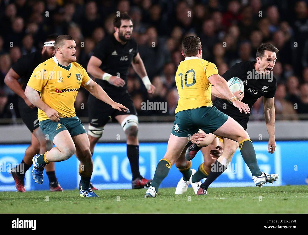 Bernard Foley of Australia challenges Ben Smith of New Zealand during ...