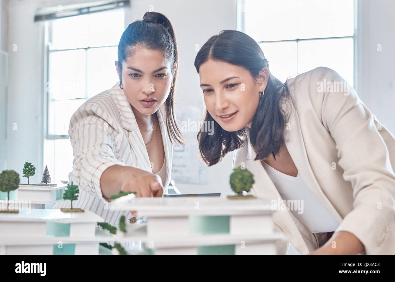Architect, team and engineer meeting while women discuss 3d ...