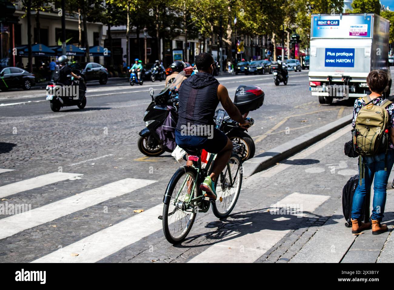 Paris, France - September 05, 2022 People cycling on the streets ...