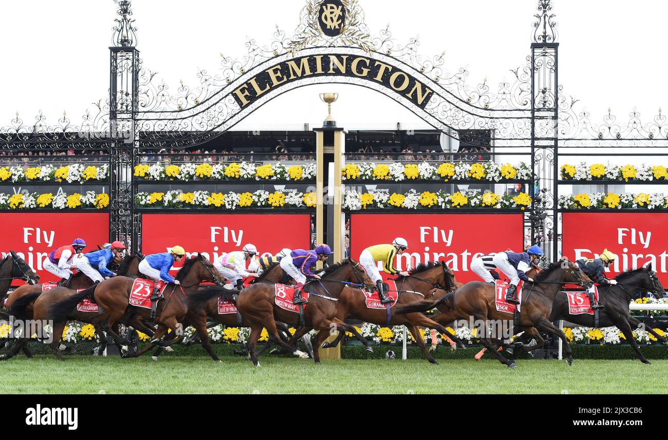 The field run past the finish line on the first lap during the ...