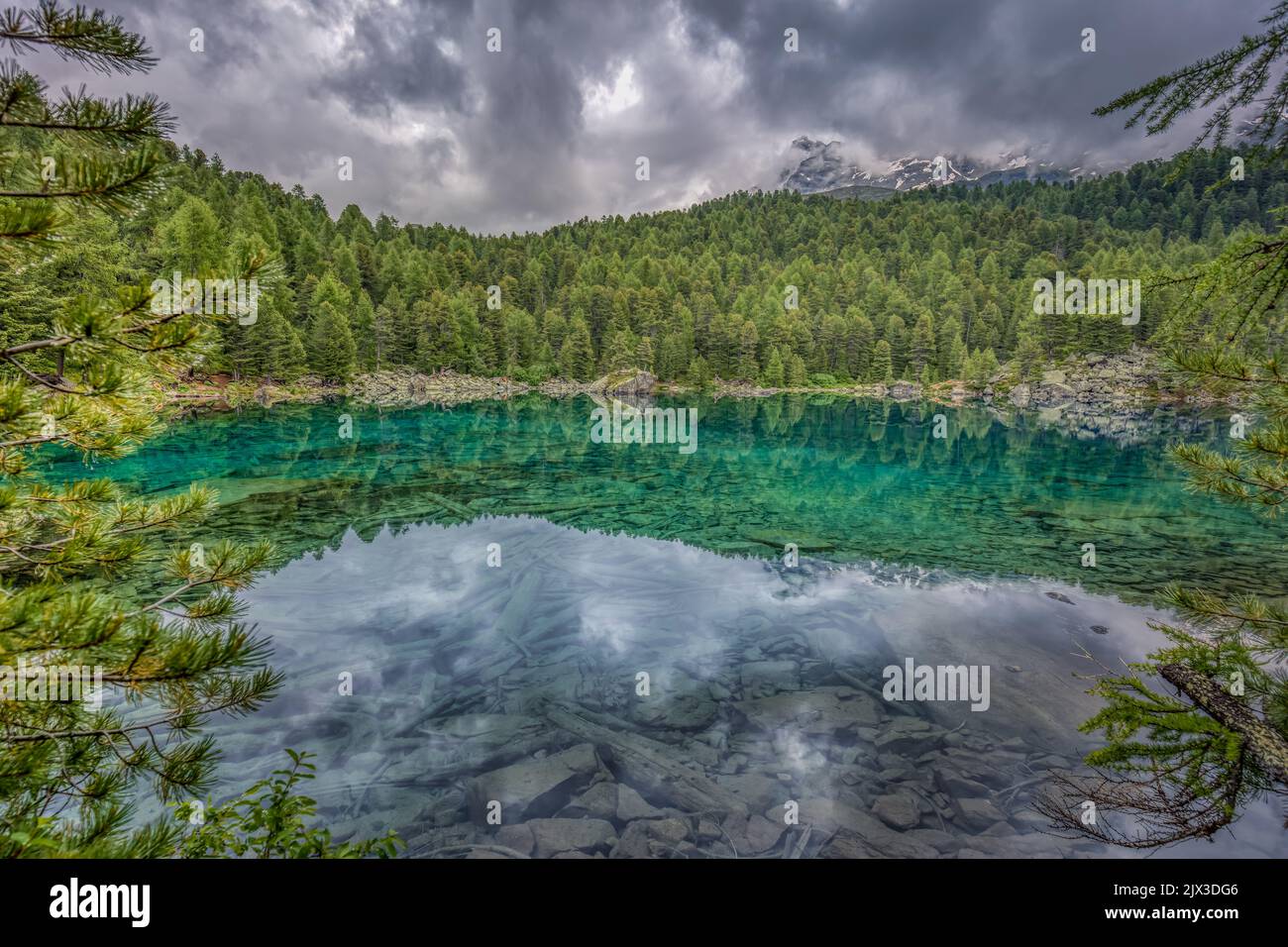 deep blue lake in the Val da Camp valley near Poschiavo, switzerland ...