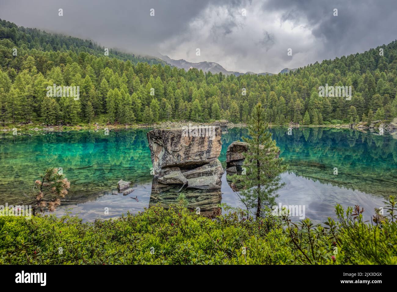 deep blue lake in the Val da Camp valley near Poschiavo, switzerland ...