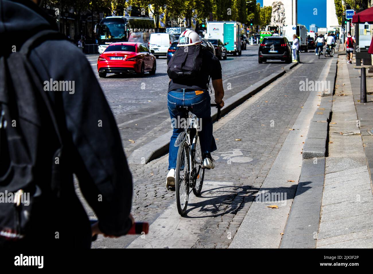 Paris, France - September 05, 2022 People cycling on the streets ...