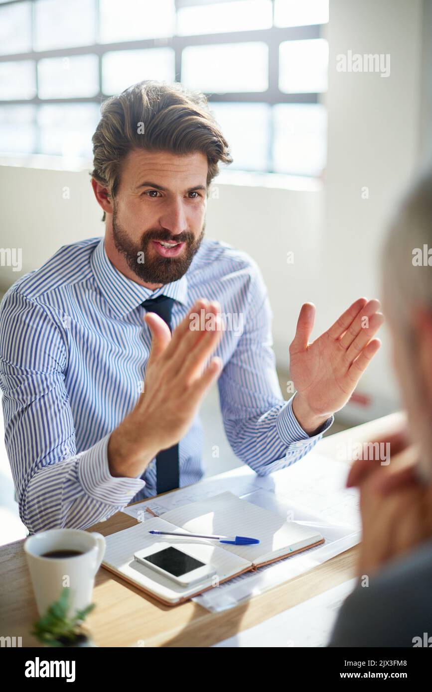 Im talking BIG picture. two businessmen talking in the office Stock ...