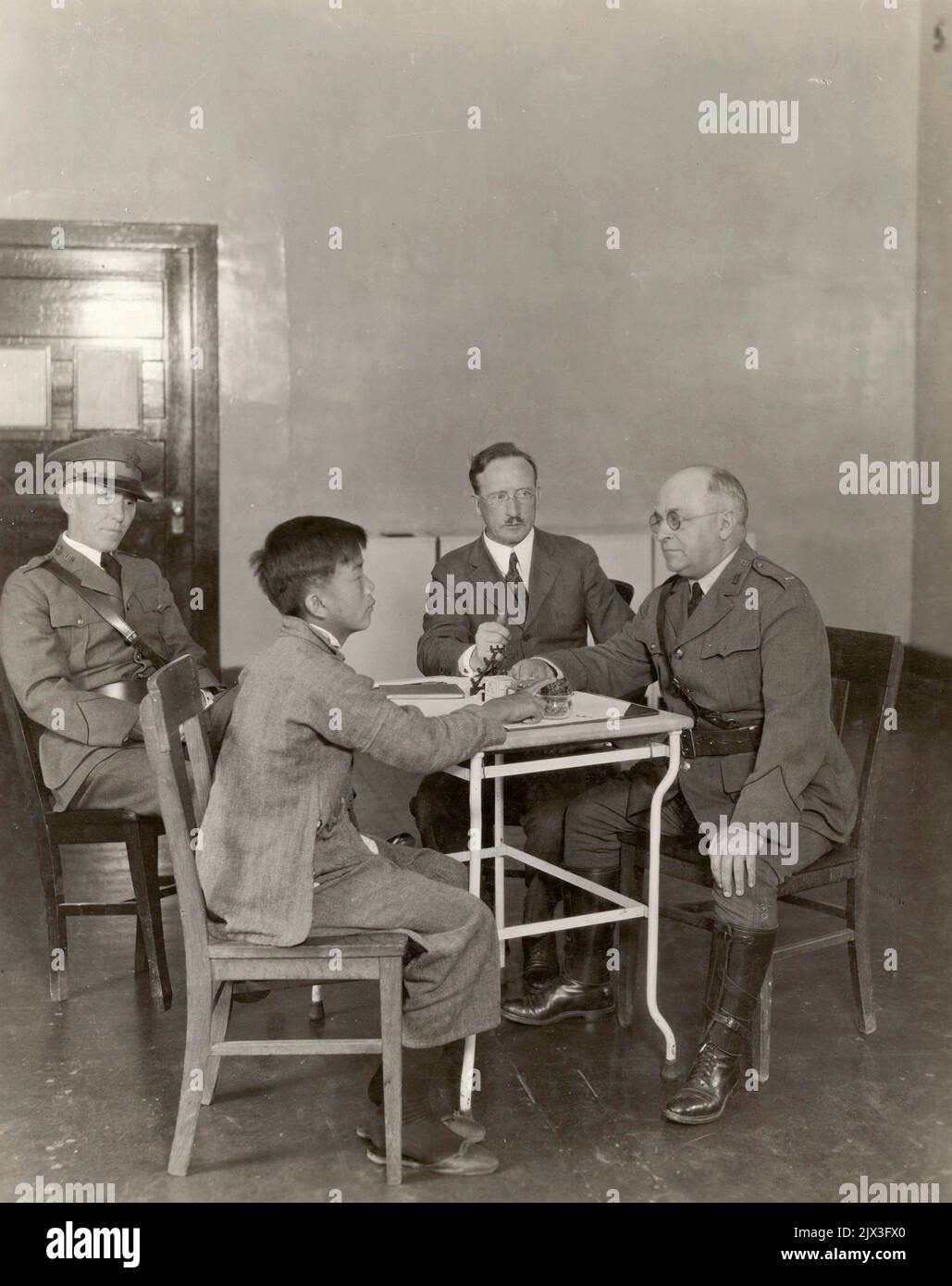Immigrant being interviewed at Angel Island Immingration Station on ...