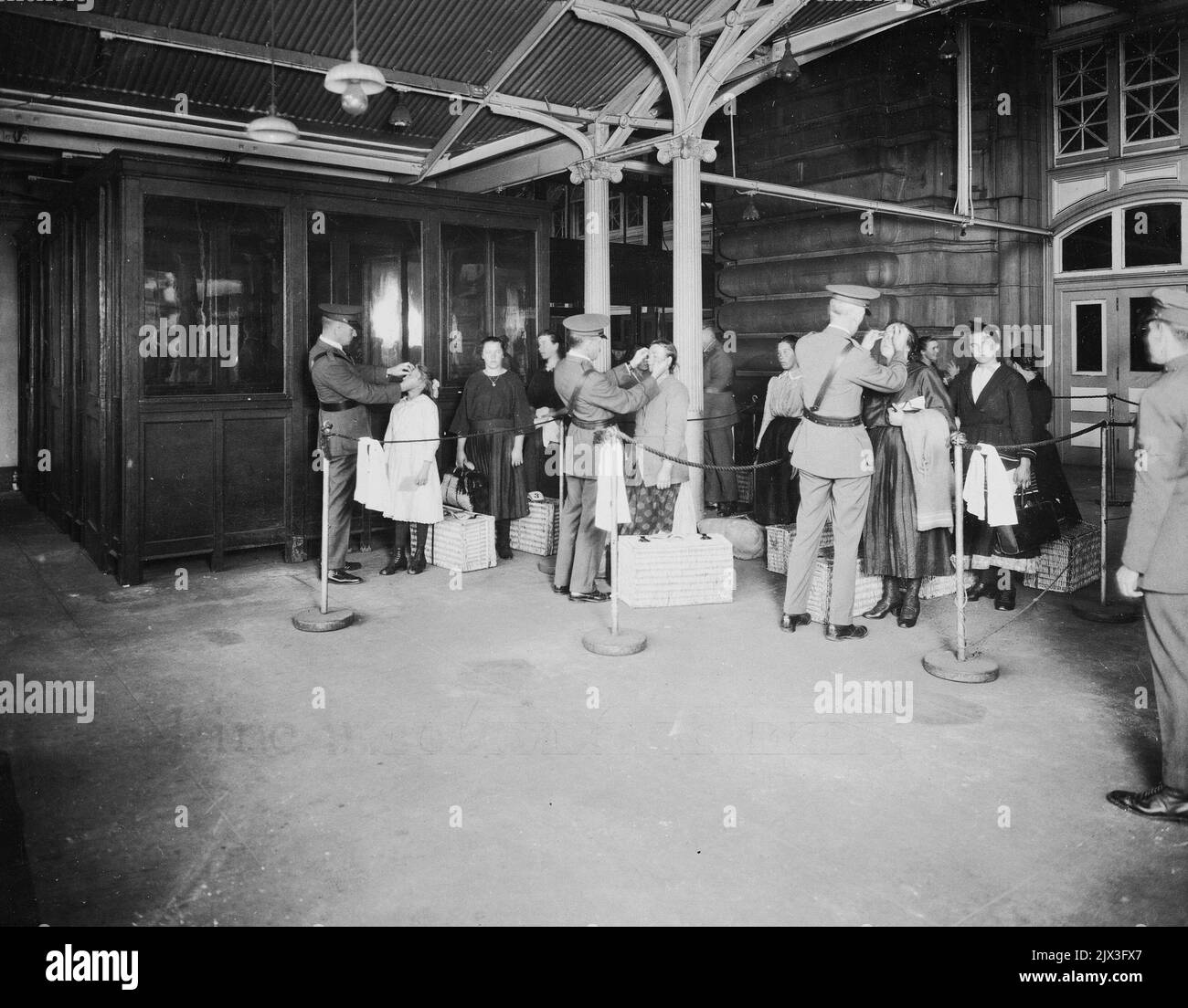 Line inspection of immigrants at Ellis Island, New York, USA. From the ...