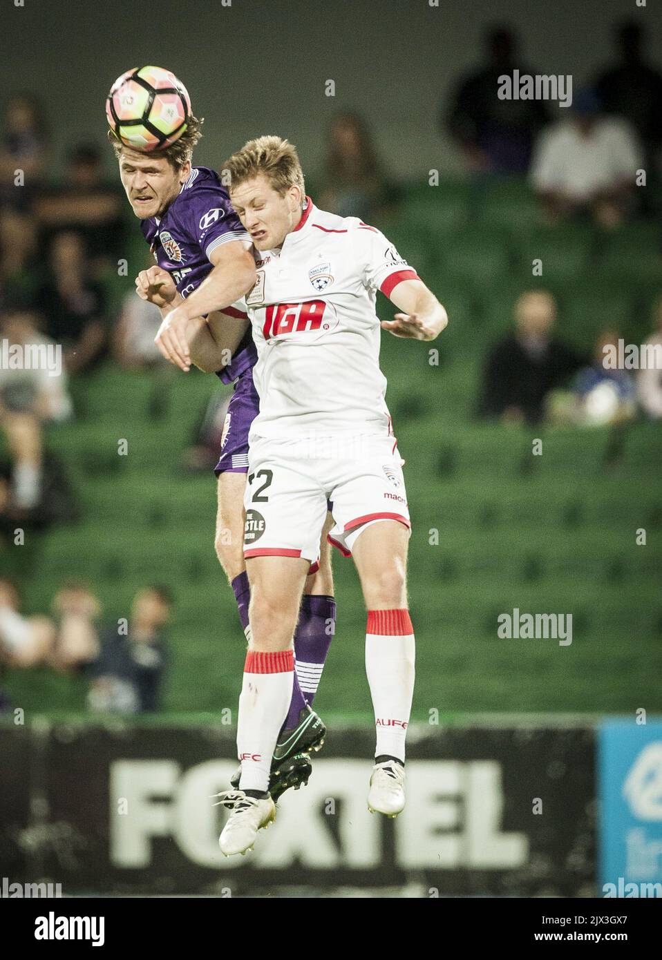 Glory's Alex Grant (left) and United's Ryan Kitto contest a header ...