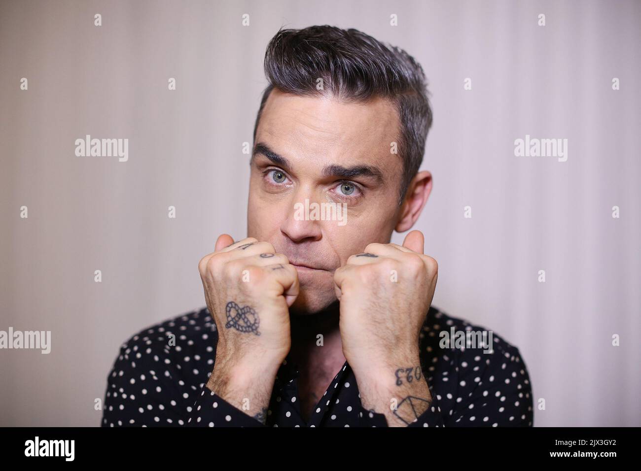 Singer Robbie Williams poses for a photograph in Sydney, Monday, Nov ...