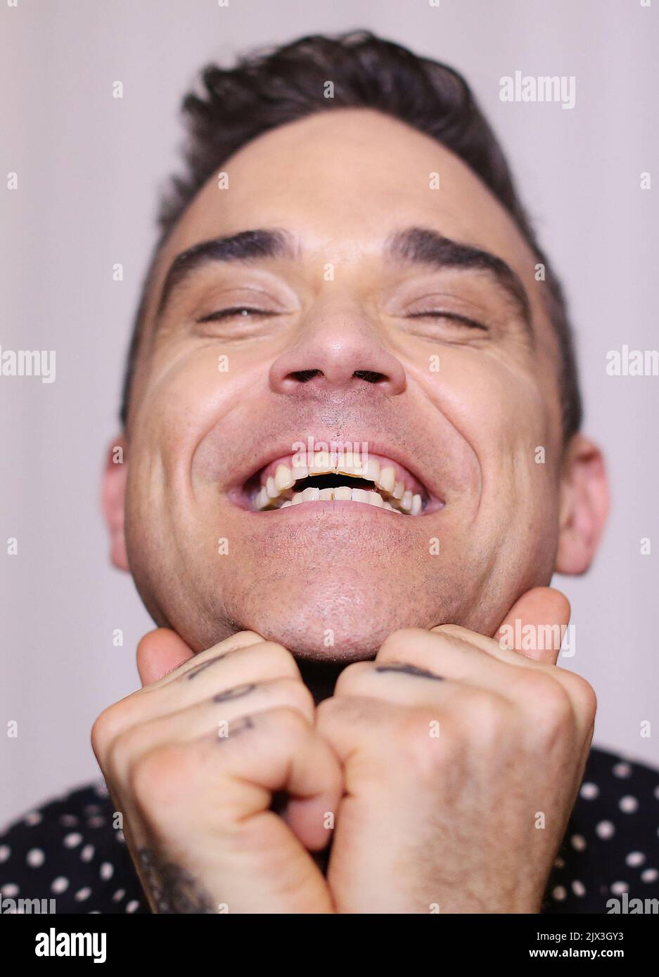 English Singer Robbie Williams poses for a photograph in Sydney, Monday ...