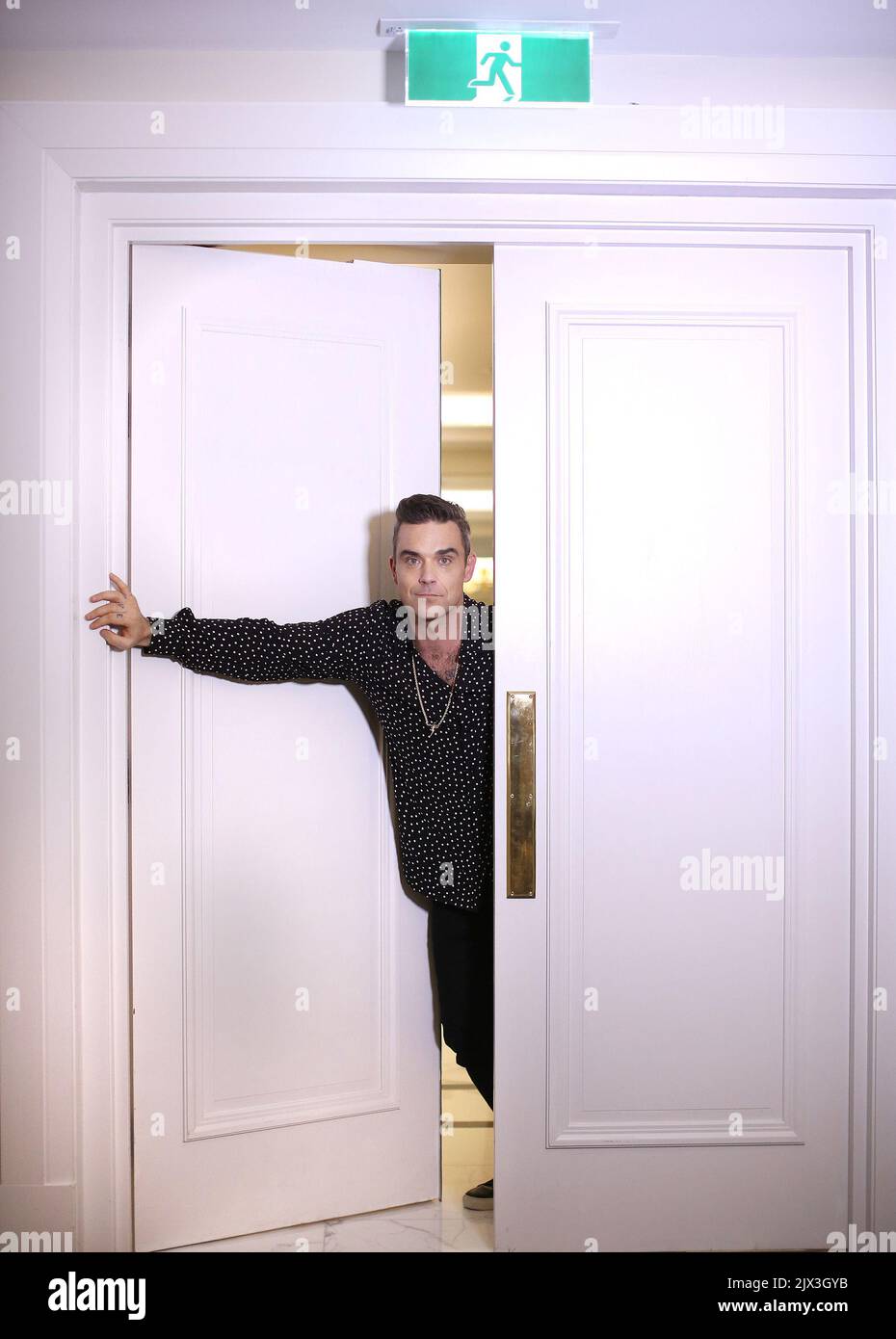 English Singer Robbie Williams poses for a photograph in Sydney, Monday ...