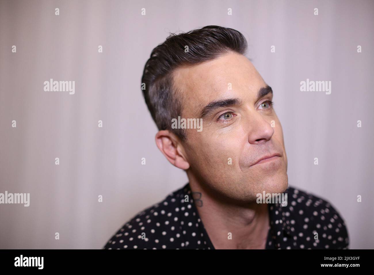 Singer Robbie Williams poses for a photograph in Sydney, Monday, Nov ...