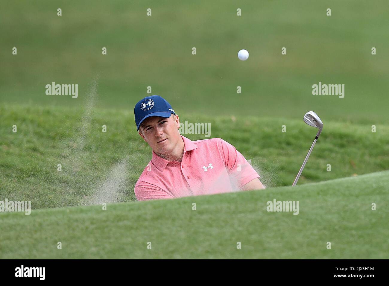 American Jordan Spieth plays a shot from the bunker on the 16th hole ...