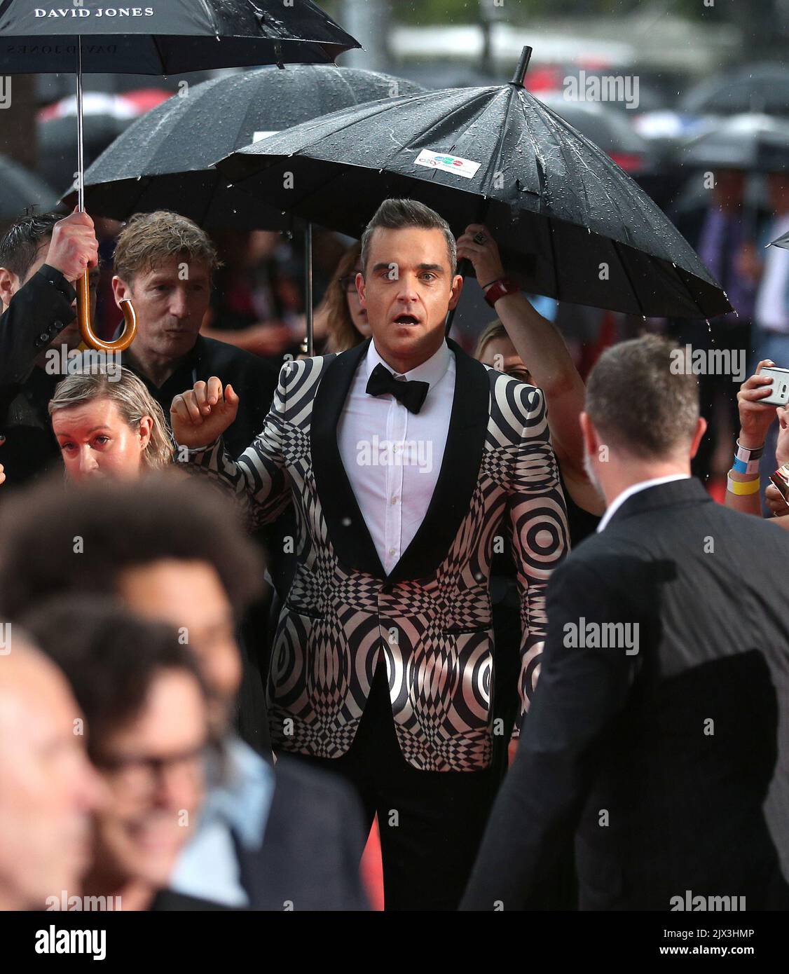 British singer Robbie Williams (centre) arrives to the 30th ARIA Awards ...