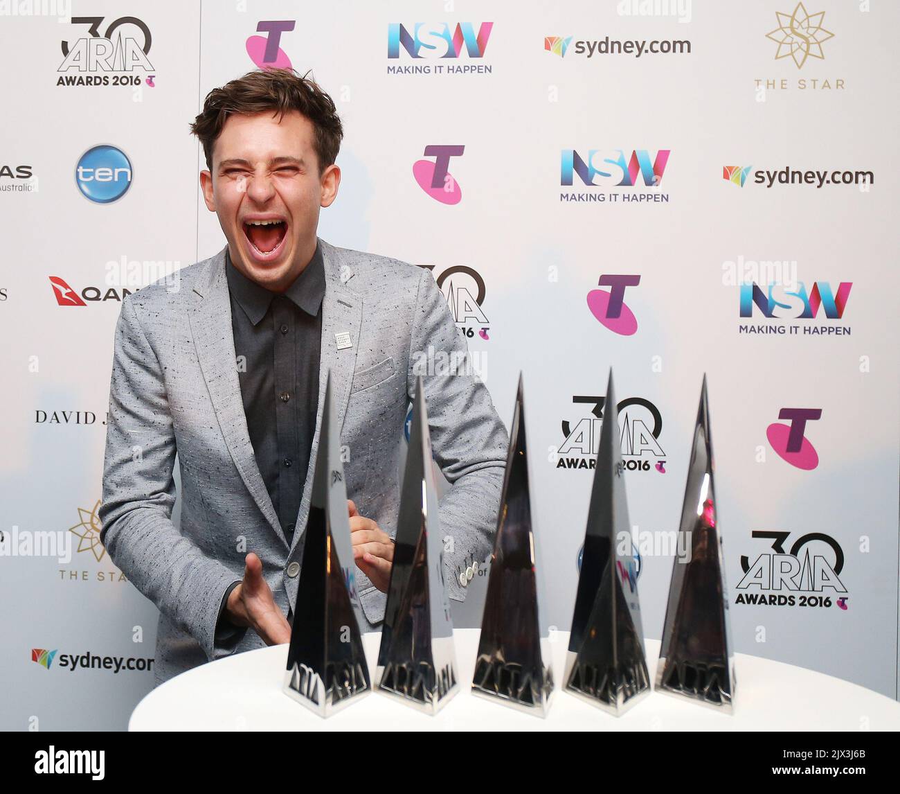Music producer Flume poses for photographs with his five ARIA awards at ...