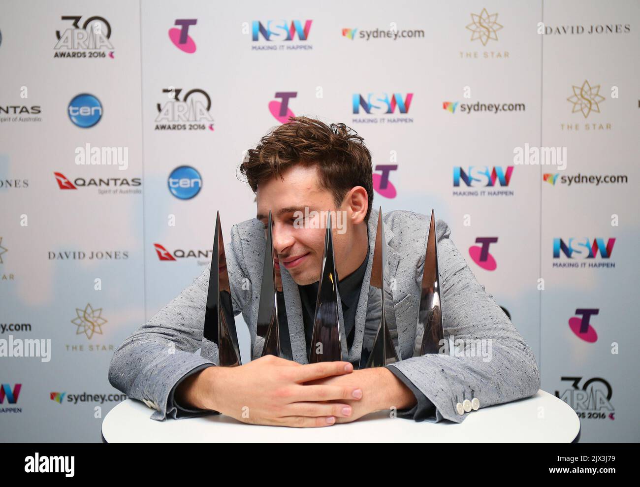 Music producer Flume poses for photographs with his five ARIA awards at ...