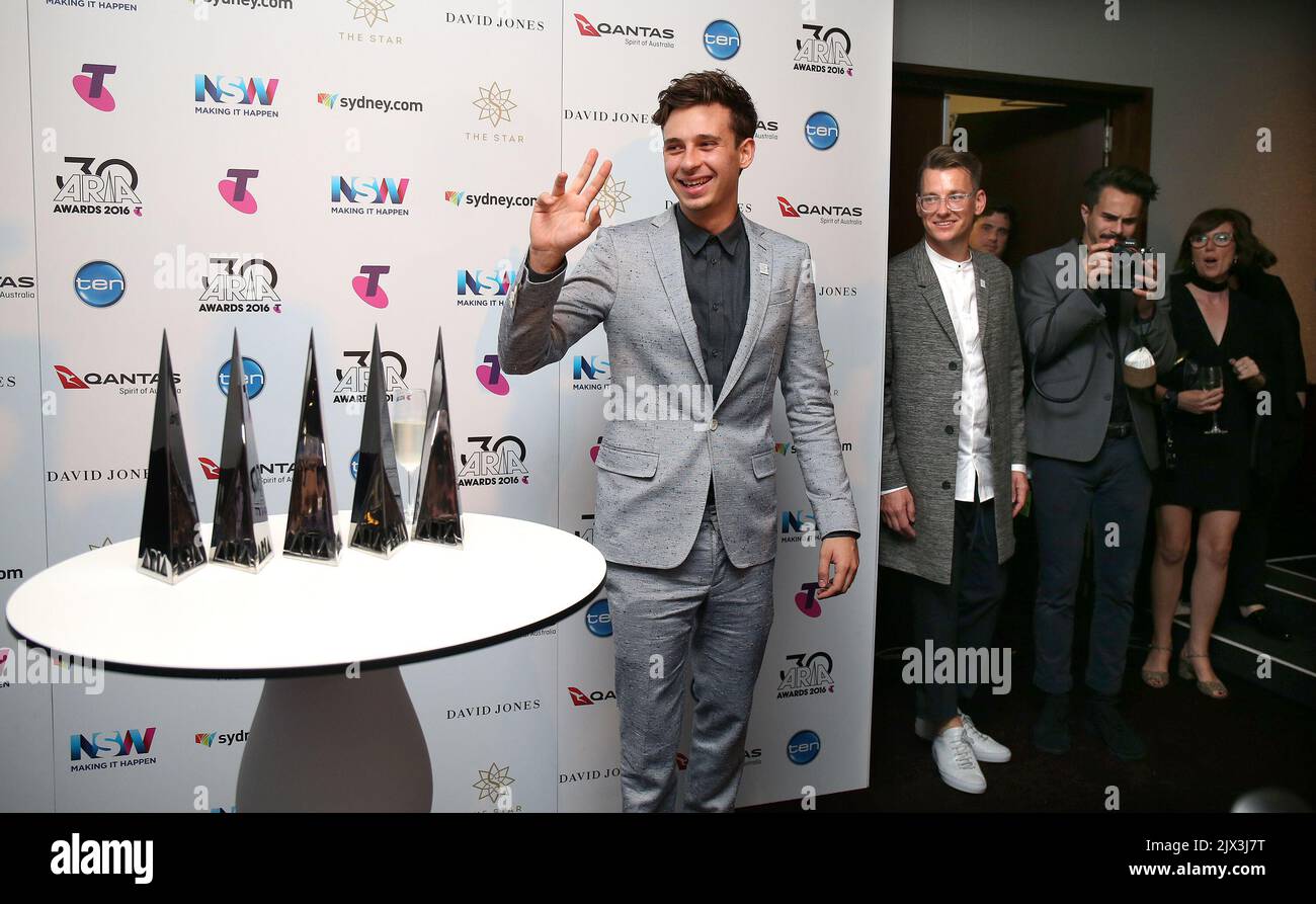 Music producer Flume poses for photographs with his five ARIA awards at ...