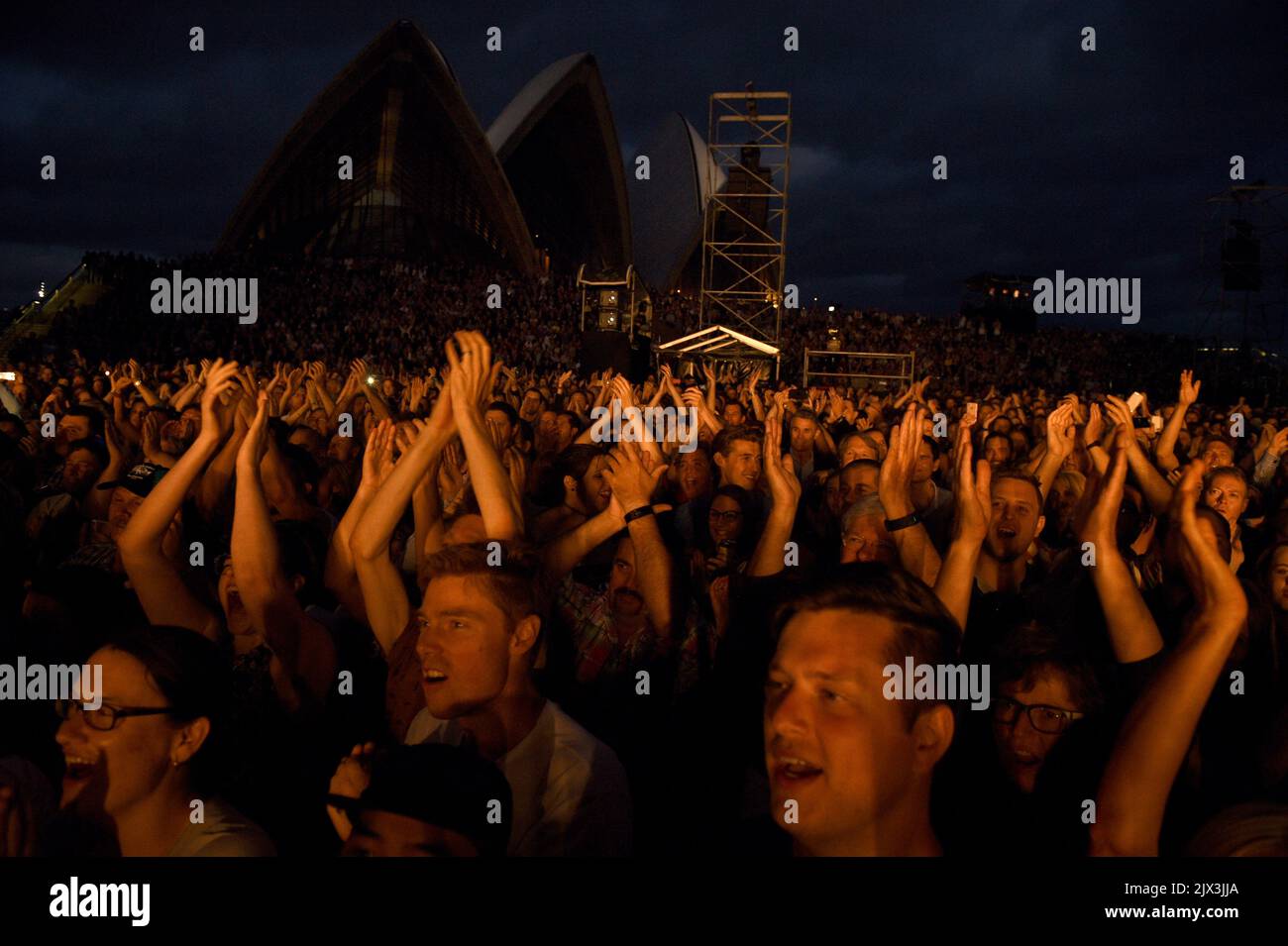 fans watch on as Crowded House perform during their 20th anniversary ...