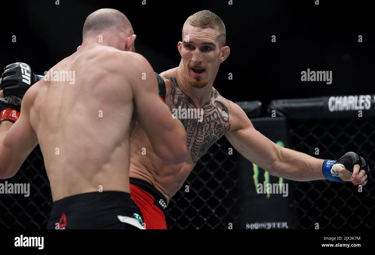 Jonathan Meunier of Canada fight Rich Walsh of Australia in a ...