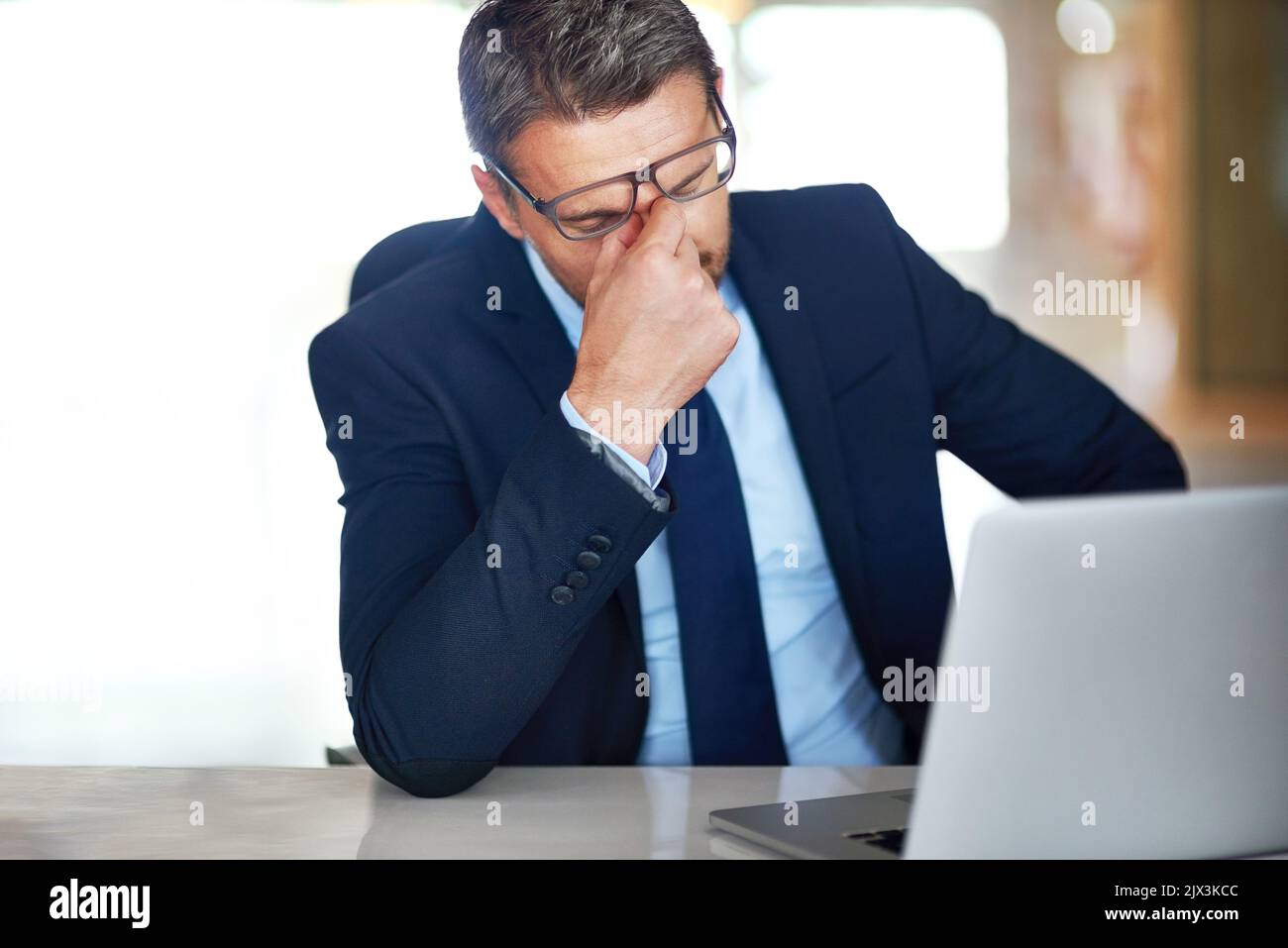 Having a very blue Monday. an overworked businessman resting with his ...