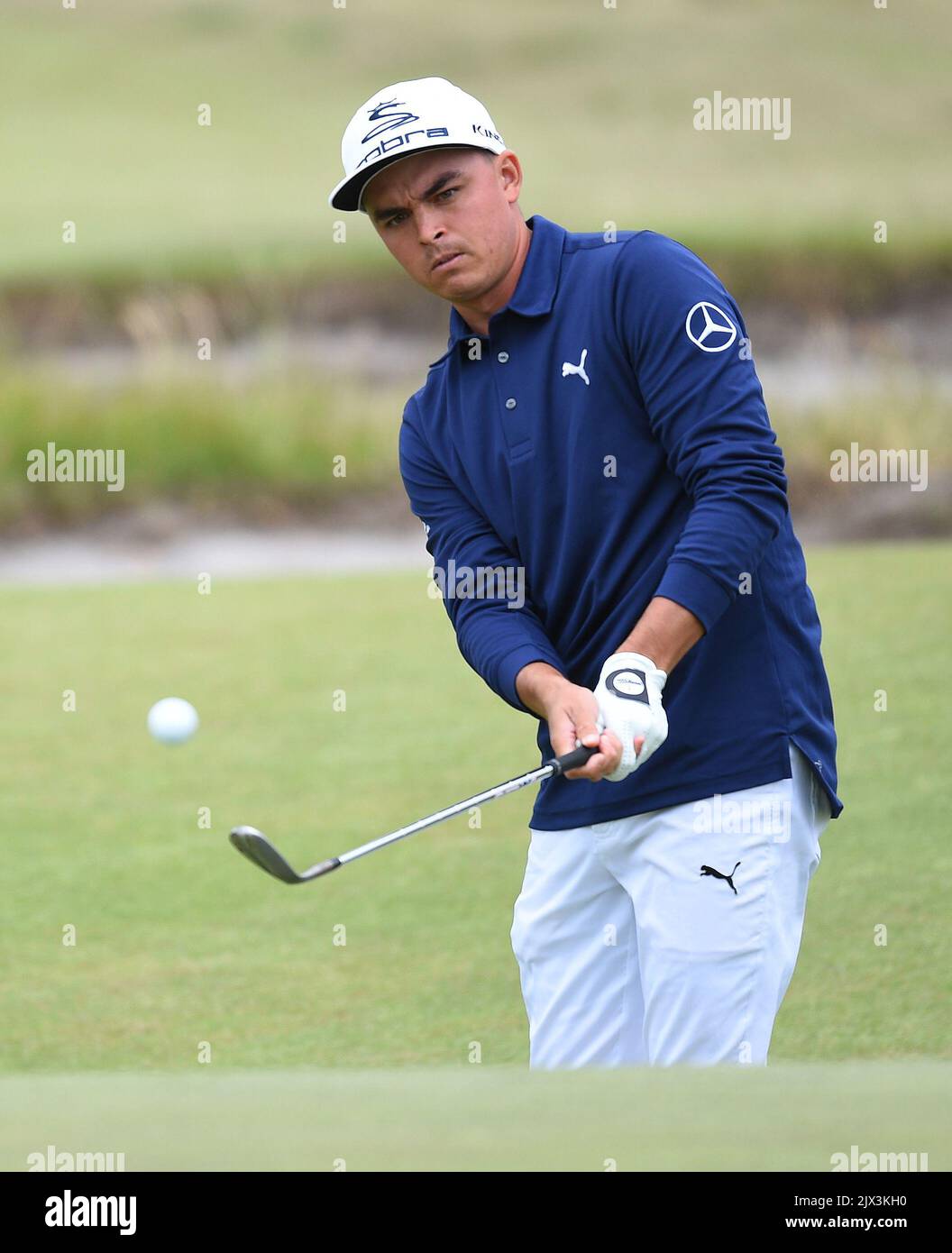 Ricky Fowler plays a chip on the 14th during round three of the World ...