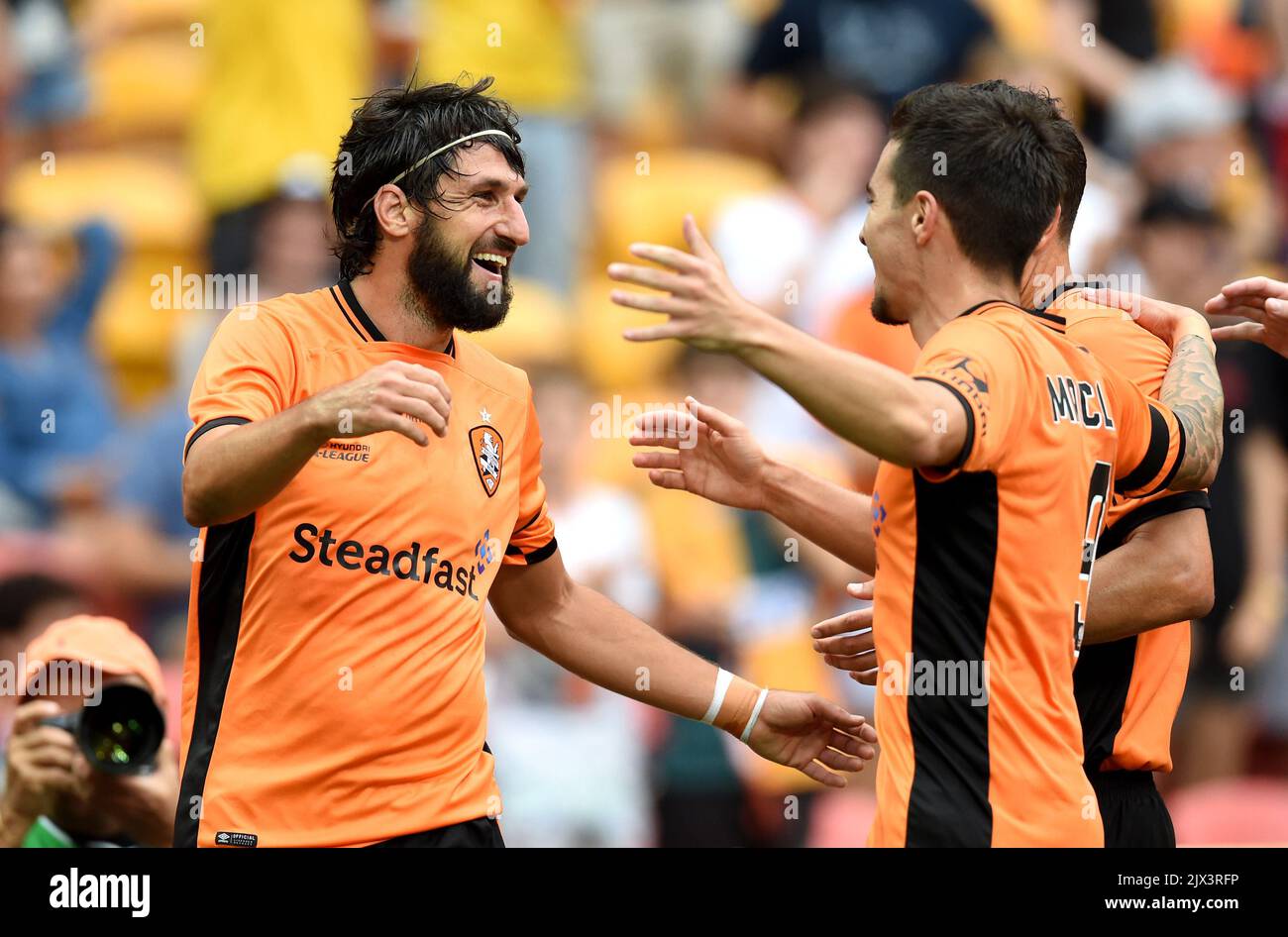 Thomas Broich of the Brisbane Roar (left) celebrates scoring a goal ...