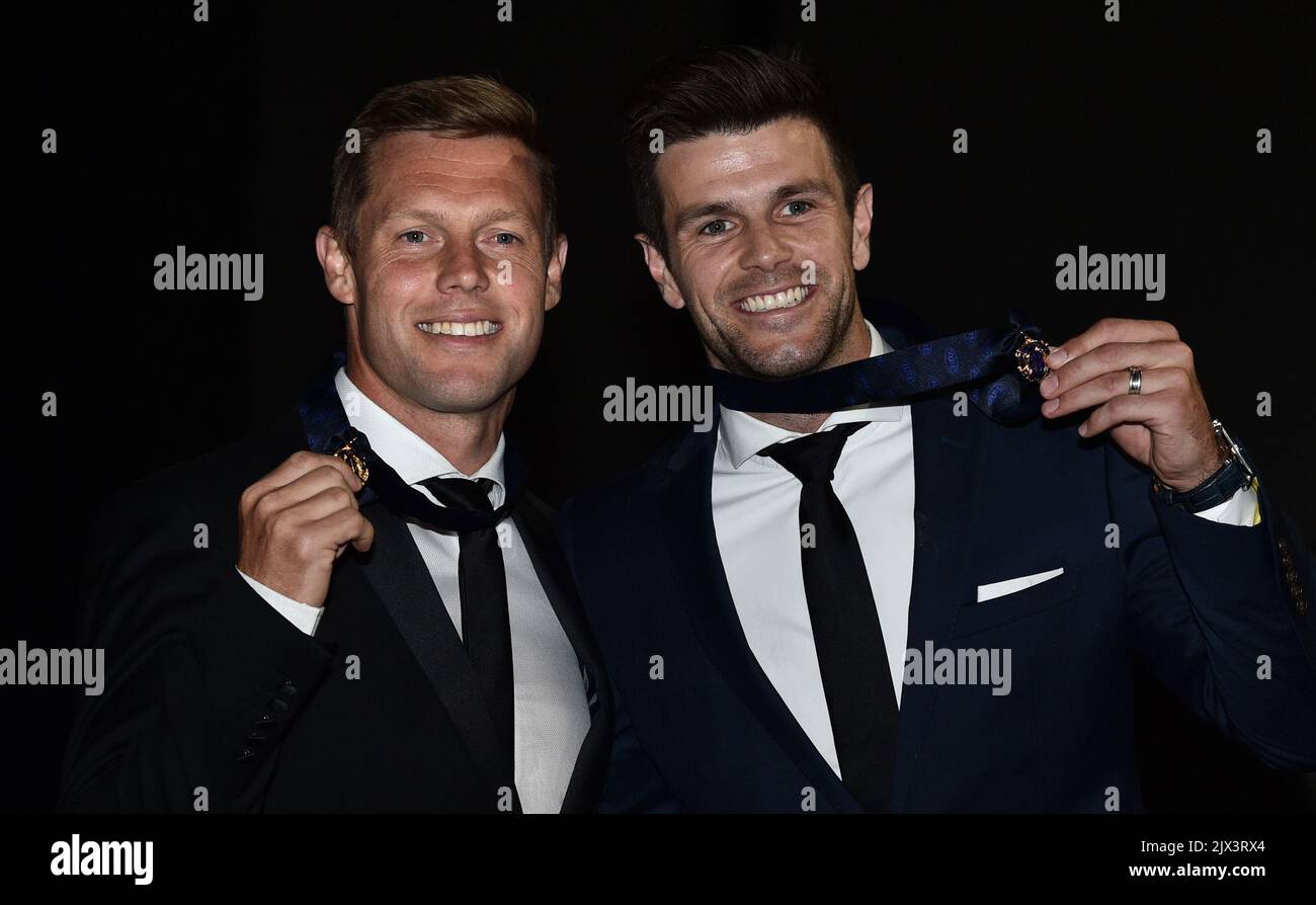 Trent Cotchin and Sam Mitchell poses for photos with their ...