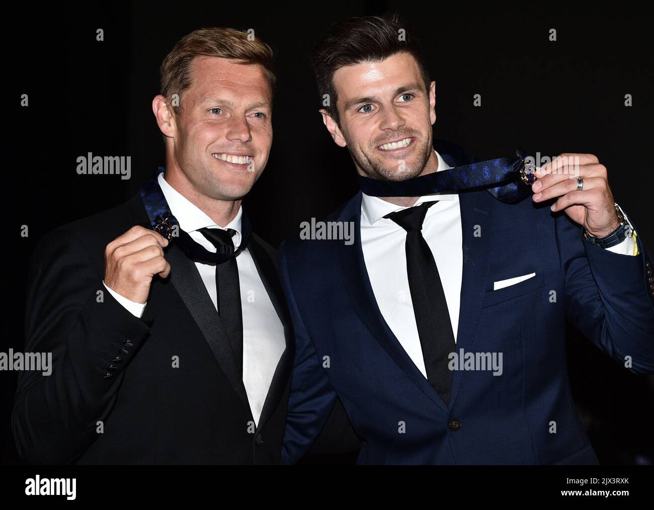 Trent Cotchin and Sam Mitchell poses for photos with their ...