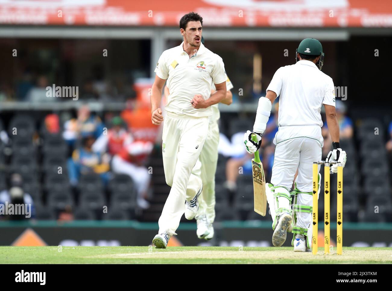 Australian bowler Mitchell Starc (left) looks at Pakistan's Azhar Ali ...