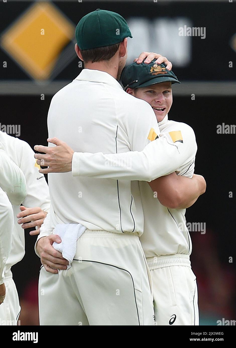 Australian captain Steve Smith (right) hugs Mitchell Starc following ...