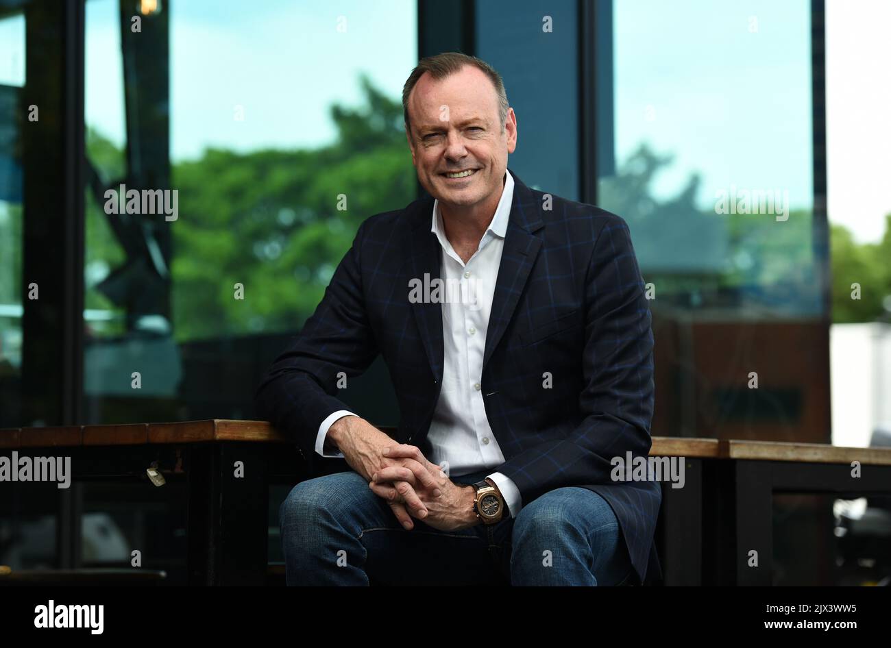 Don Meij, CEO of Domino's Pizza, poses for photos in one of the company ...